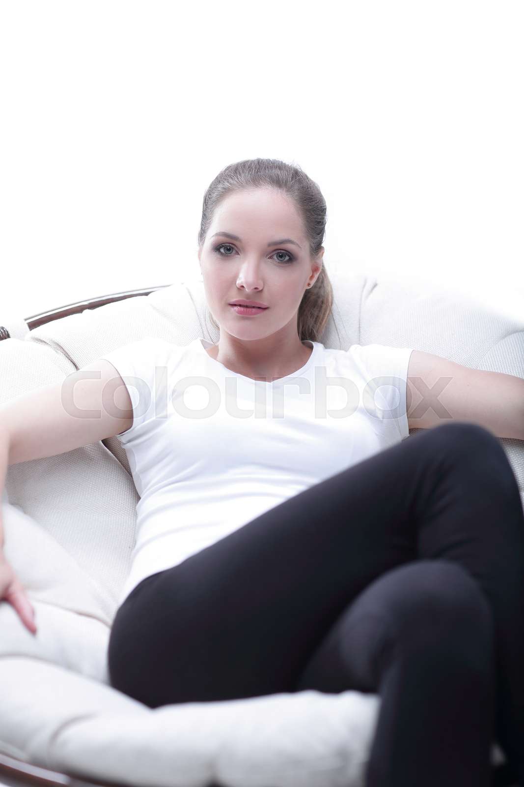 young woman resting in a circular chair with rattan | Stock image ...