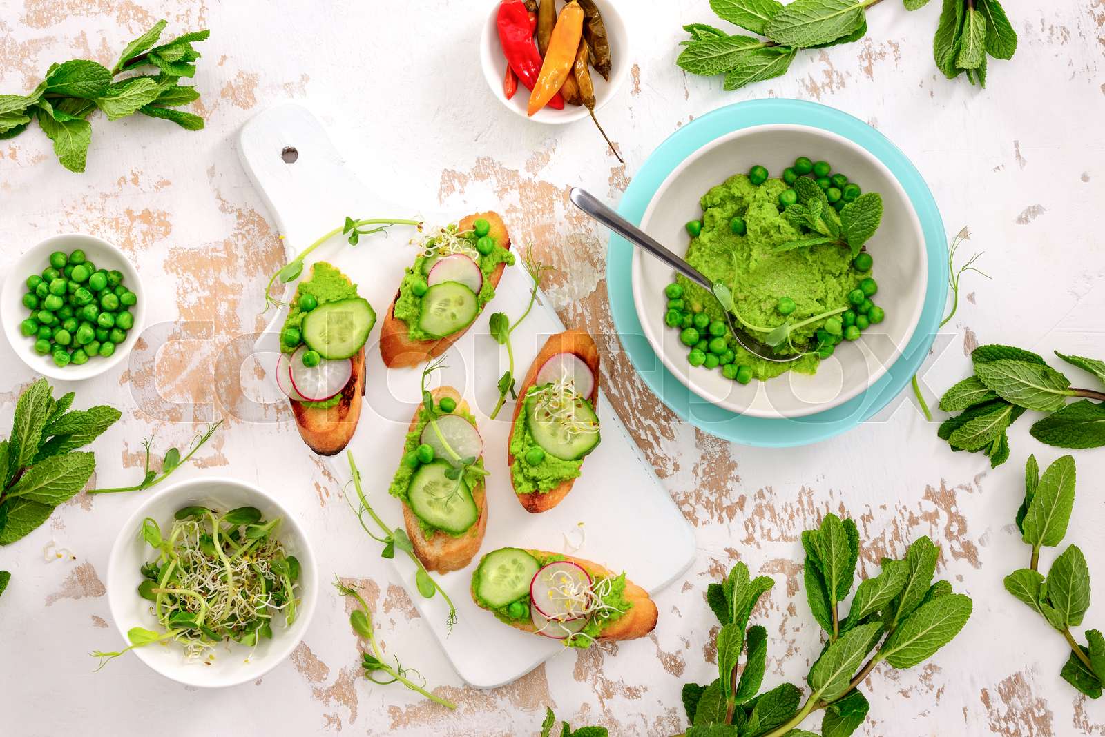 Refreshing crusty canapes with green peas and mint pesto | Stock image ...