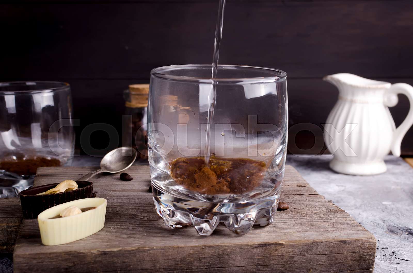 pouring boiling water into a glass of coffee | Stock image | Colourbox