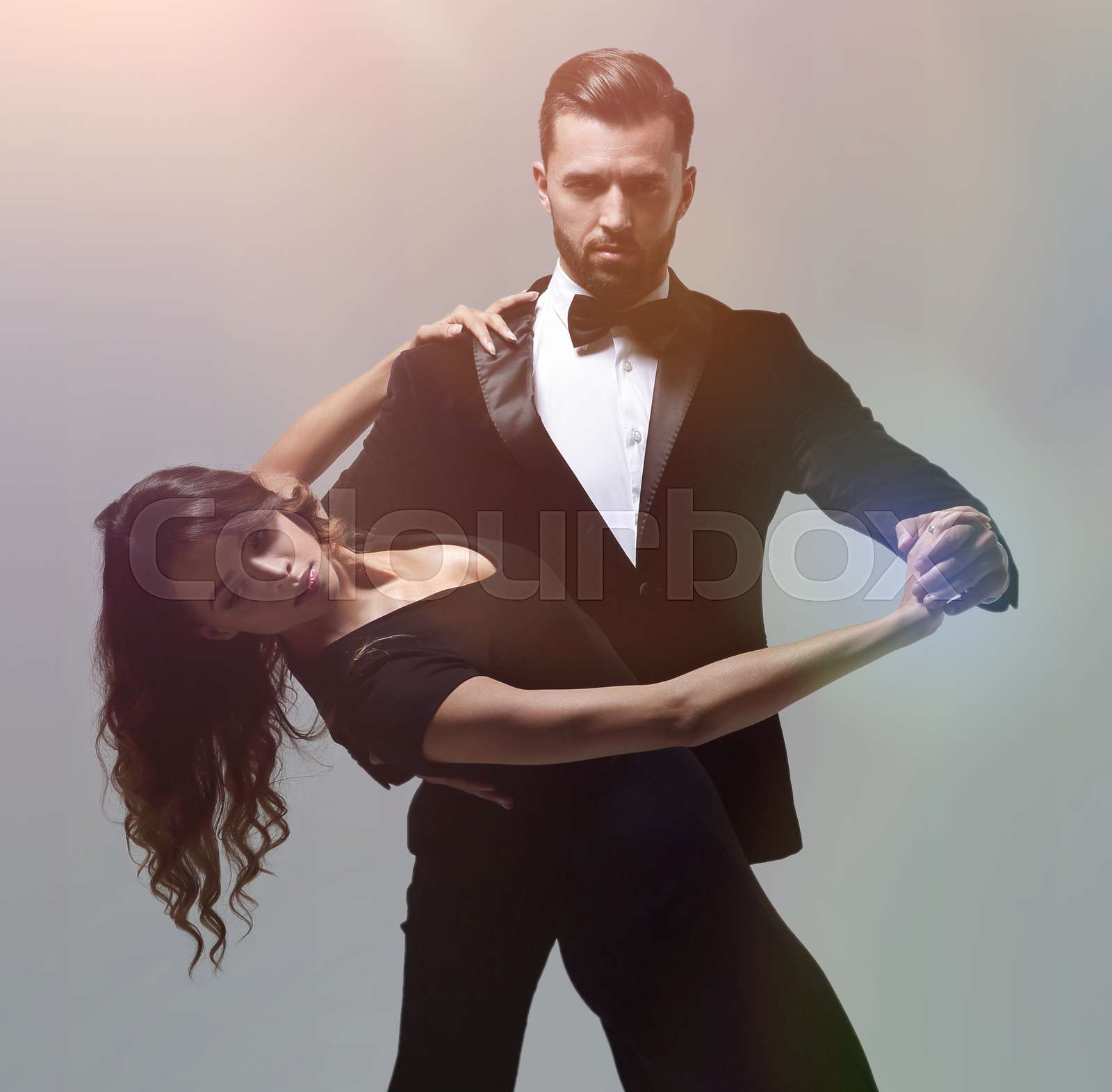 Attractive young couple dancing in studio. | Stock image | Colourbox