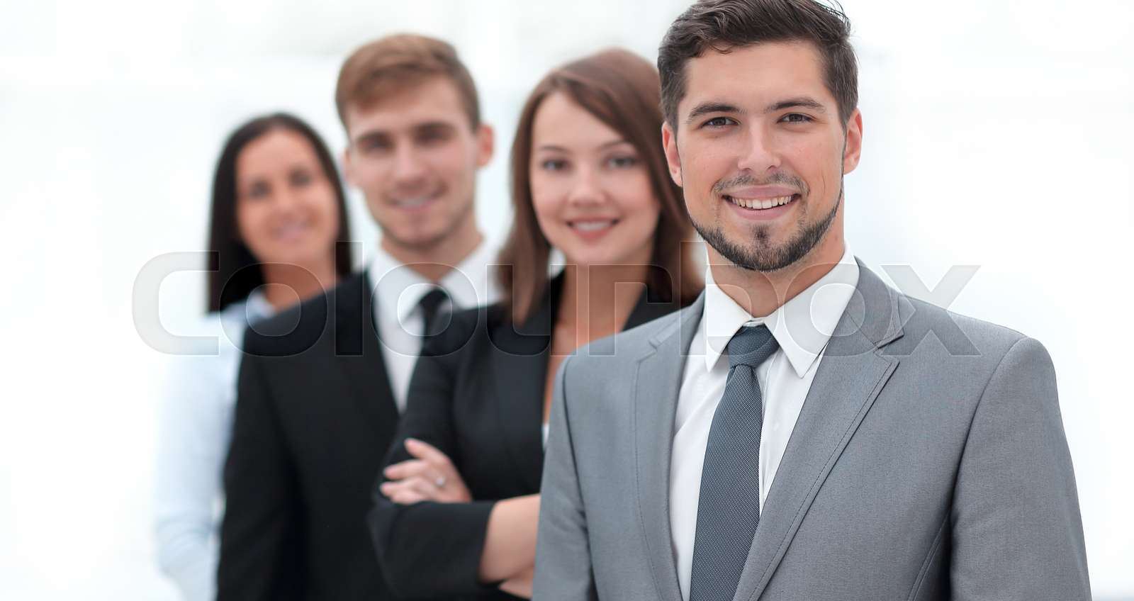 leader and the business team standing one behind the other. | Stock ...