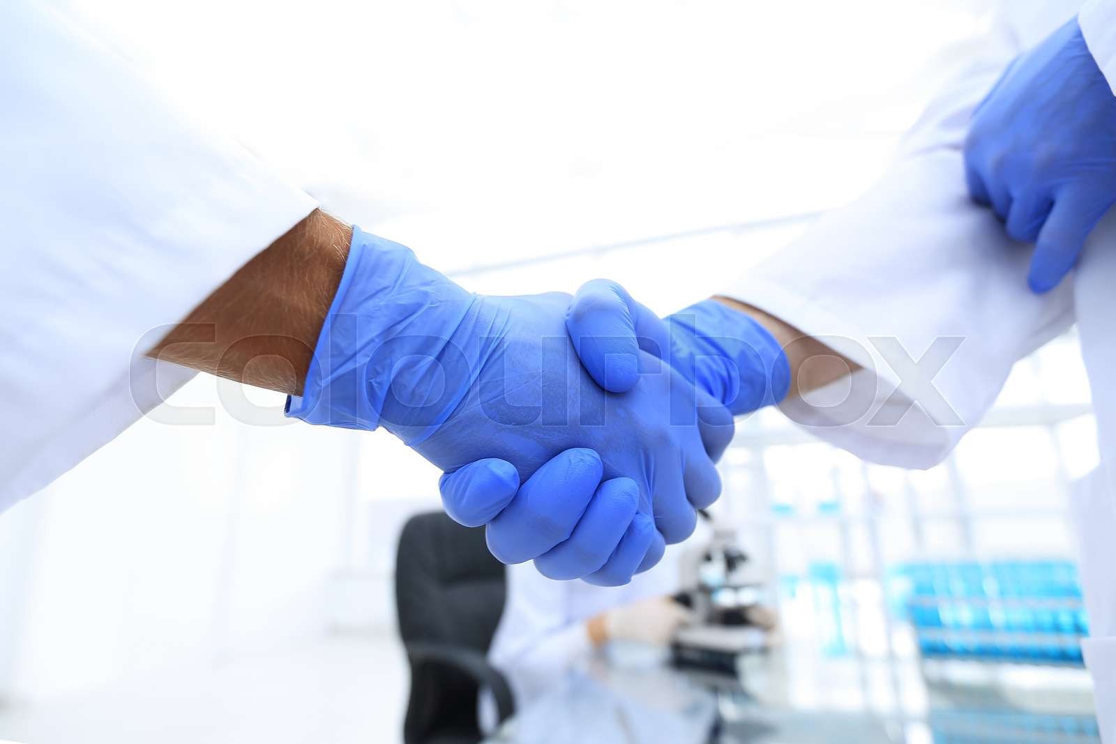 hand in the medical glove (handshake) | Stock image | Colourbox