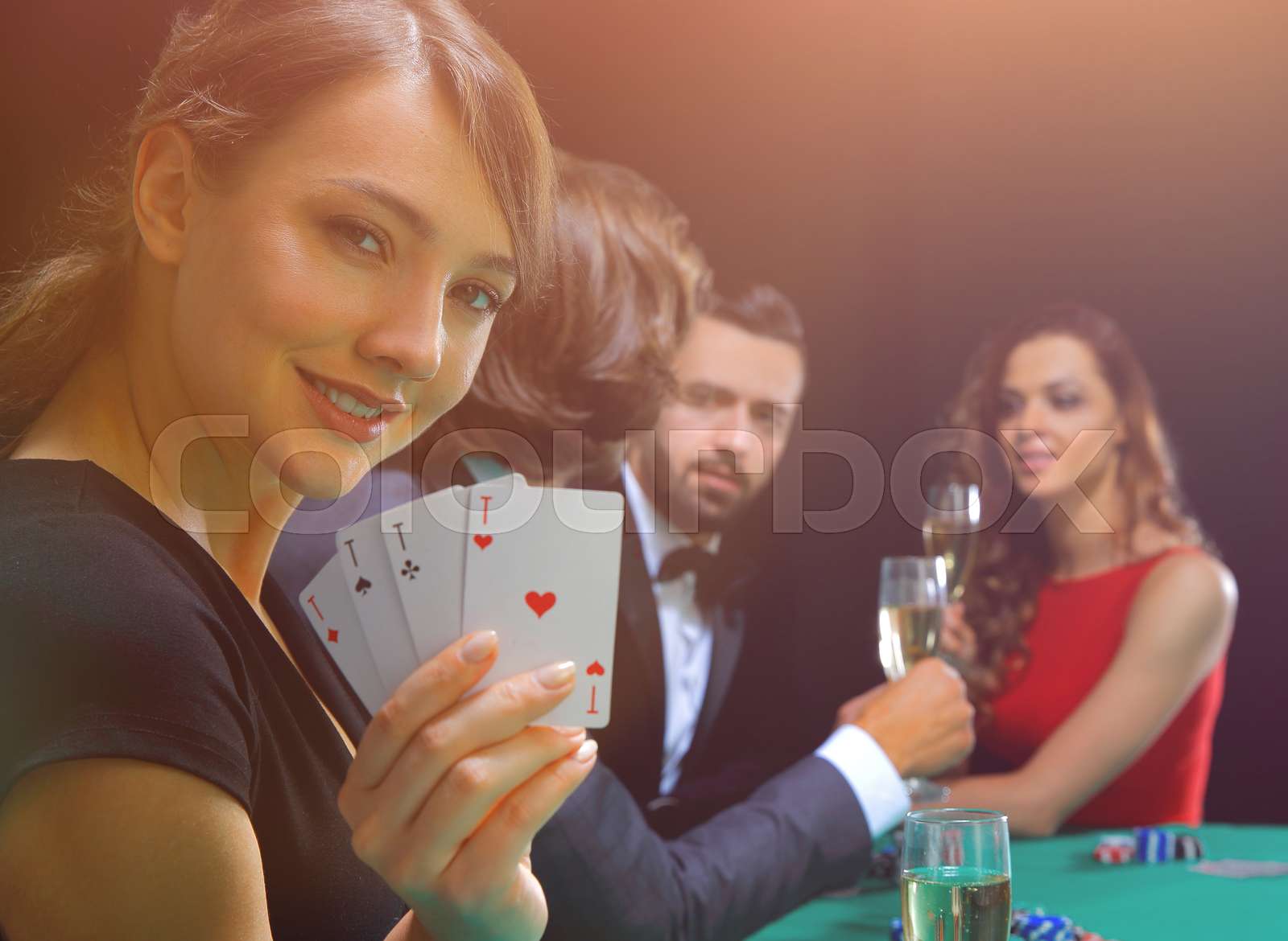 Portrait of the female gambler at the poker table with cards | Stock ...