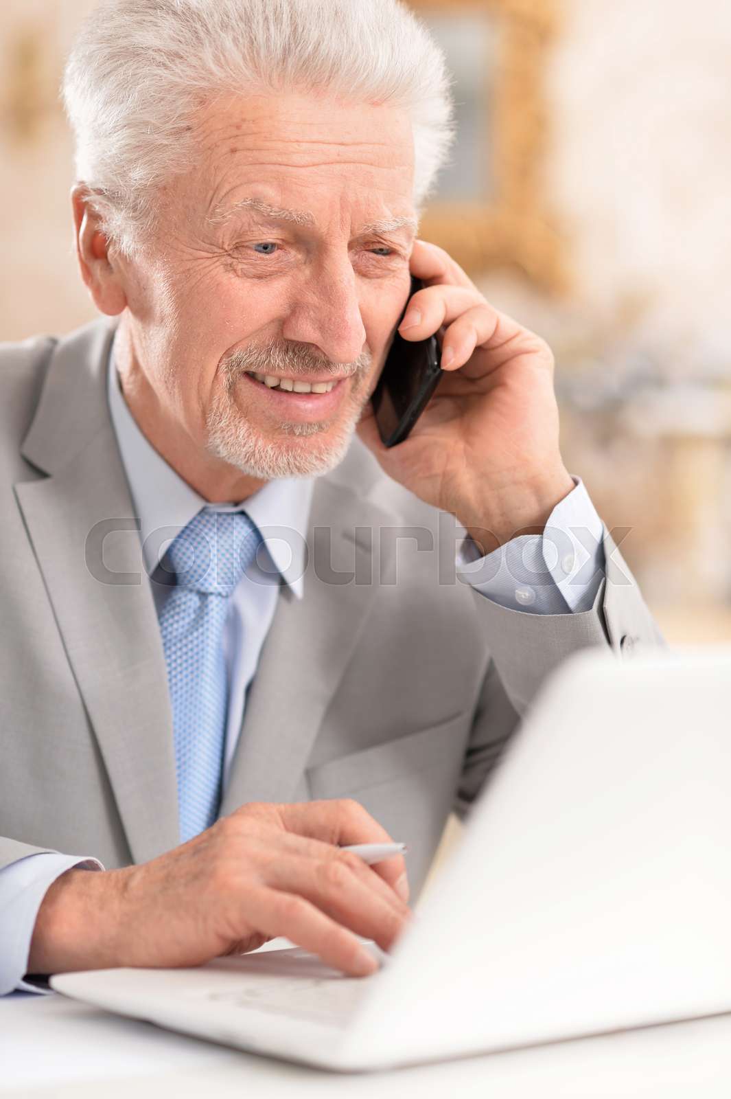 elderly man with phone | Stock image | Colourbox