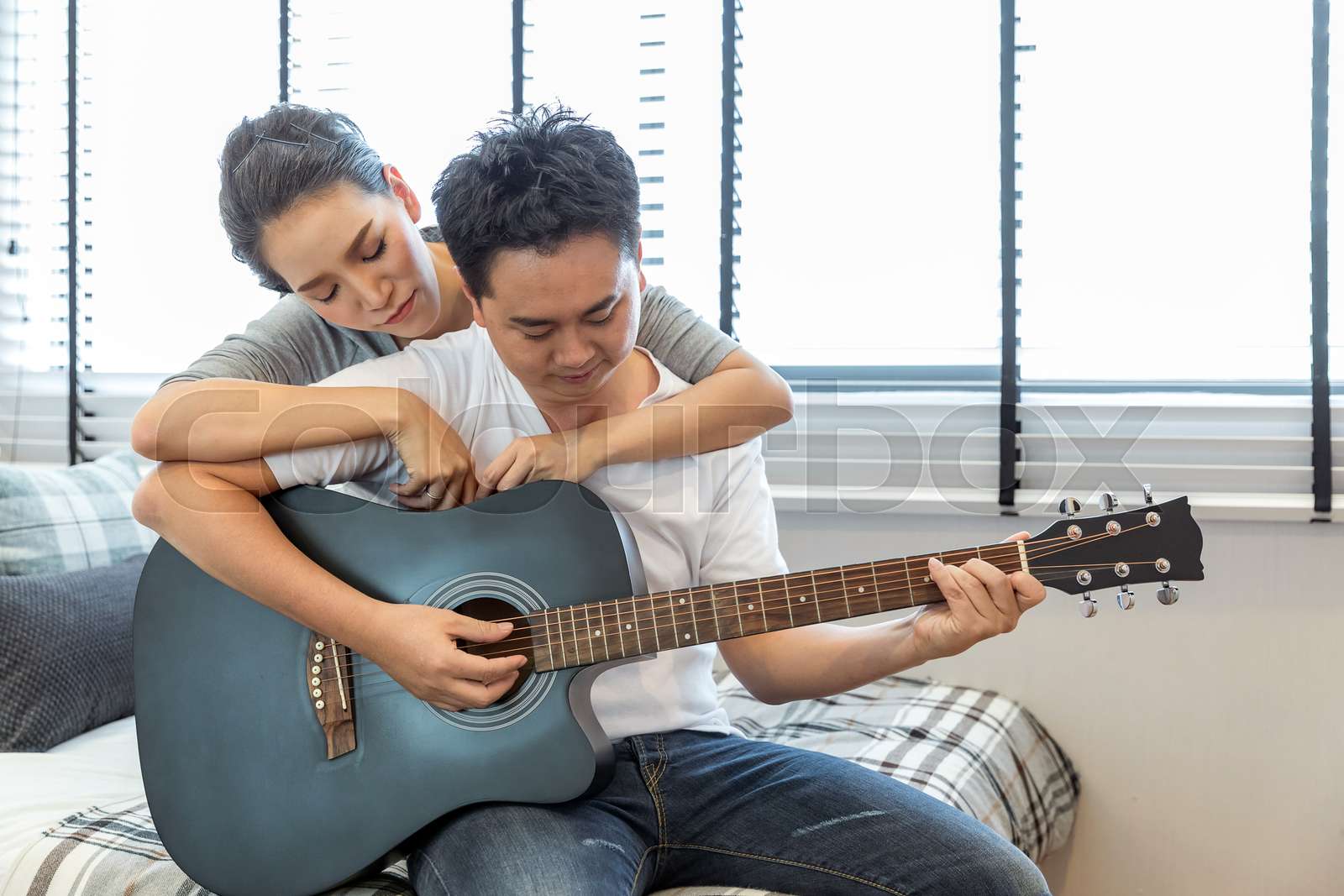 Couples playing guitar | Stock image | Colourbox