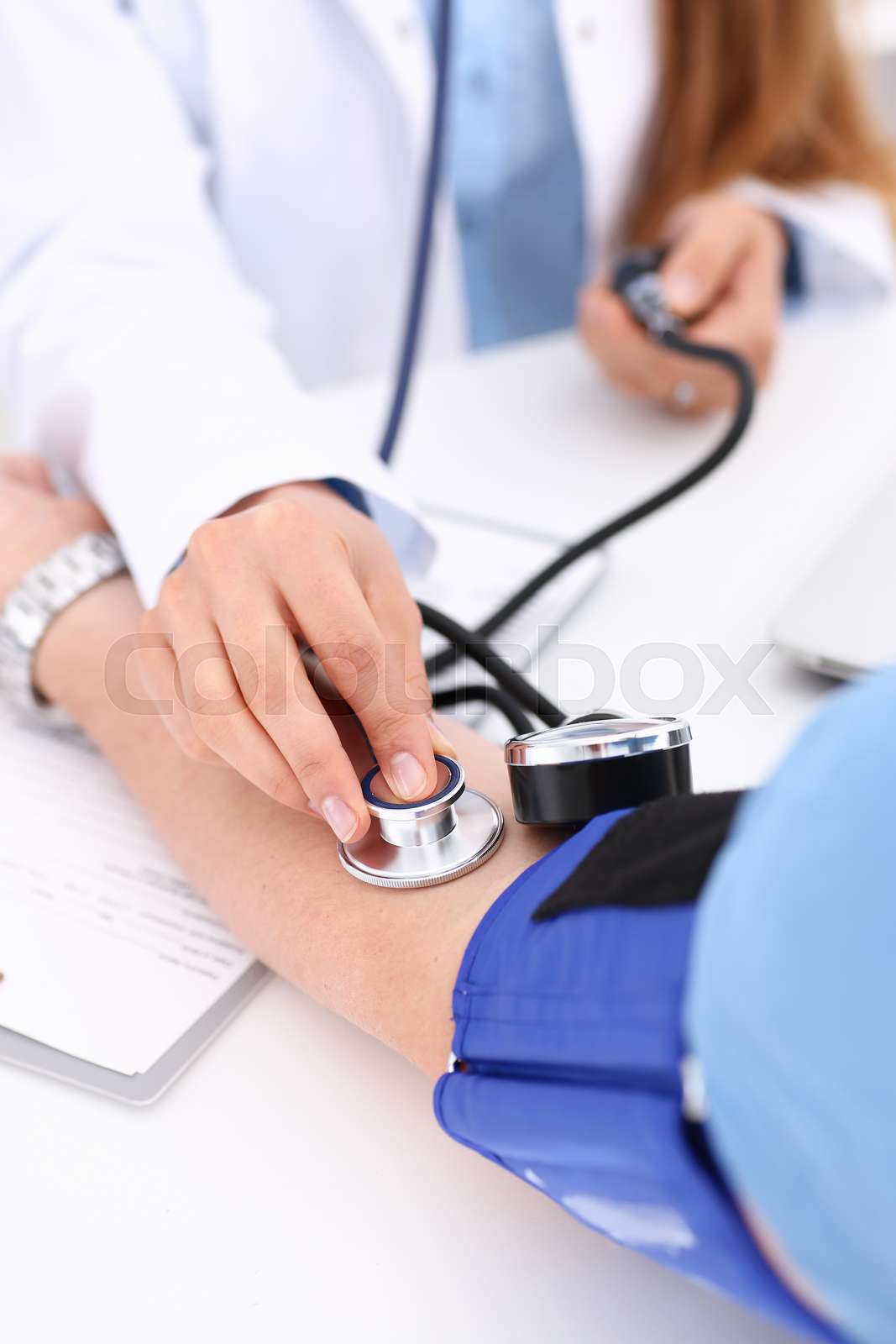 Female doctor arms make medic procedure closeup | Stock image | Colourbox