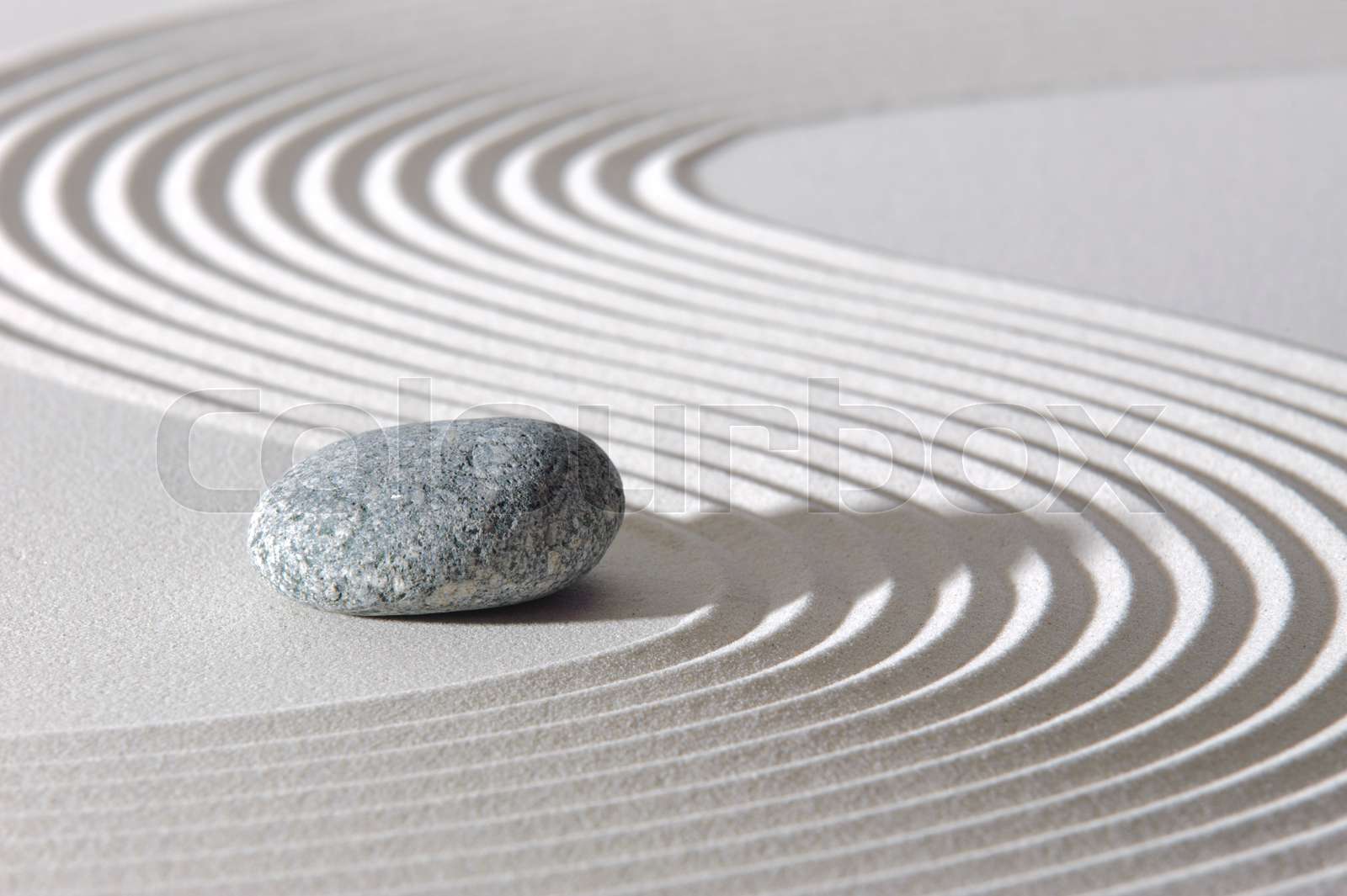 Japanese Zen garden with stone in textured sand | Stock image | Colourbox