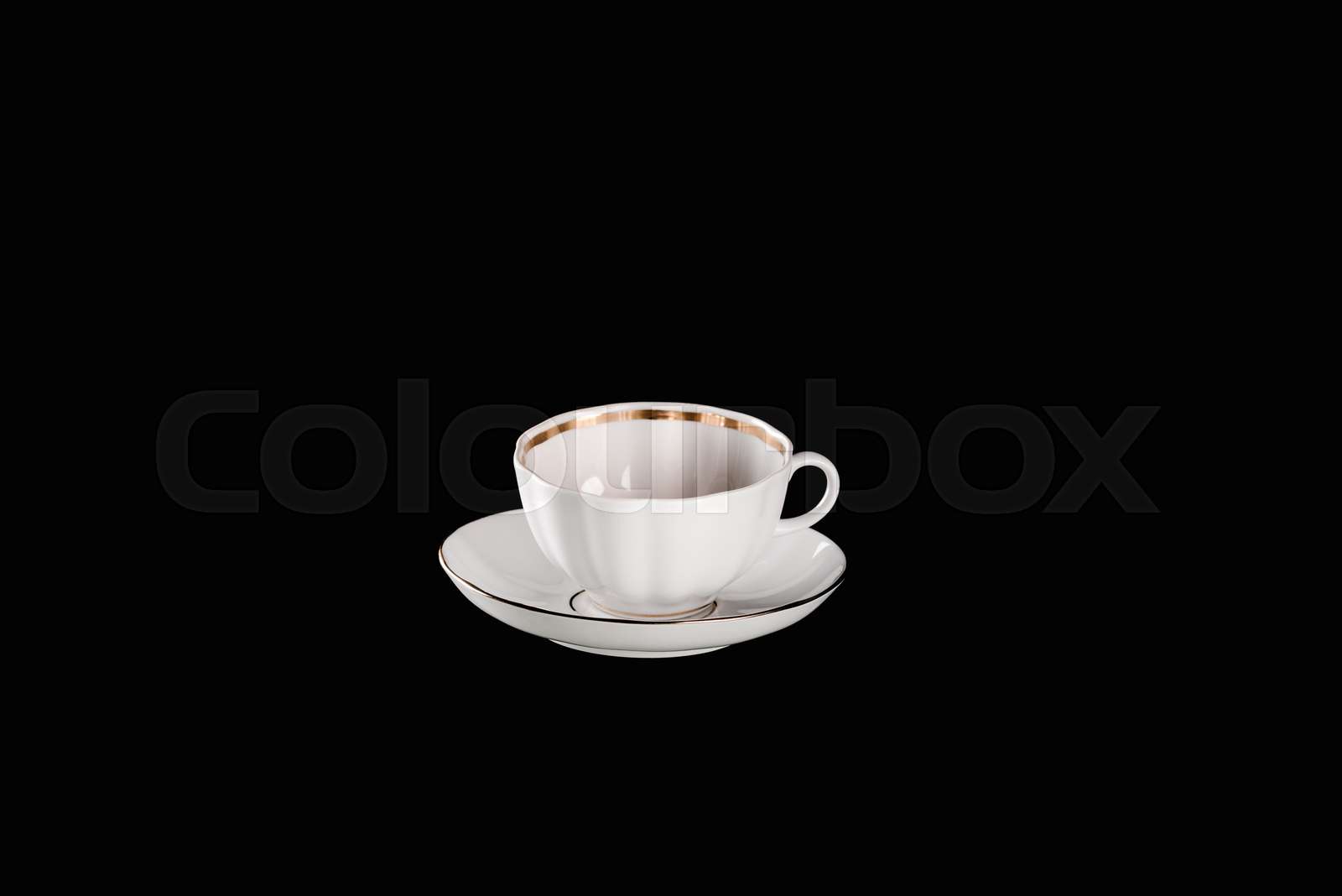 white cup and plate isolated on black | Stock image | Colourbox