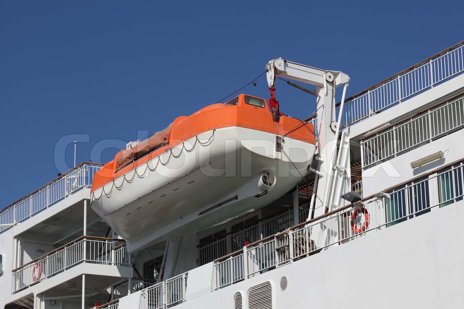 Lifeboat on a davit at a modern ferry ship | Stock image | Colourbox