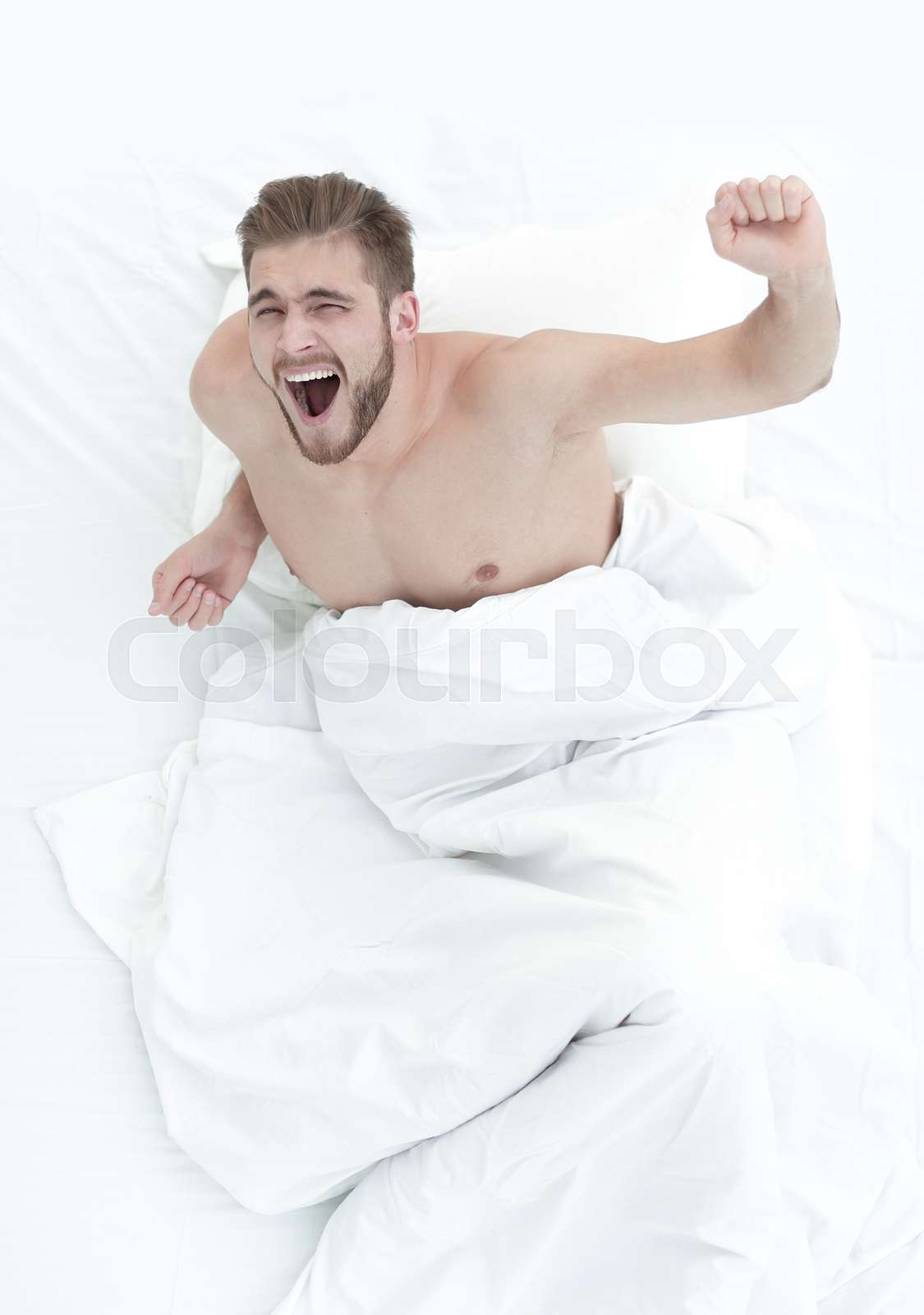 top view.a very happy man Sunday morning | Stock image | Colourbox