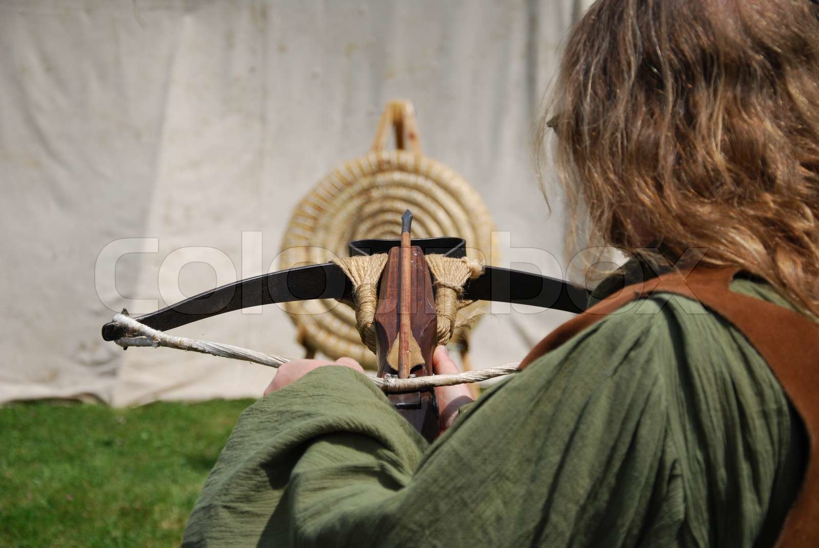 crossbow archer shooting on target | Stock image | Colourbox