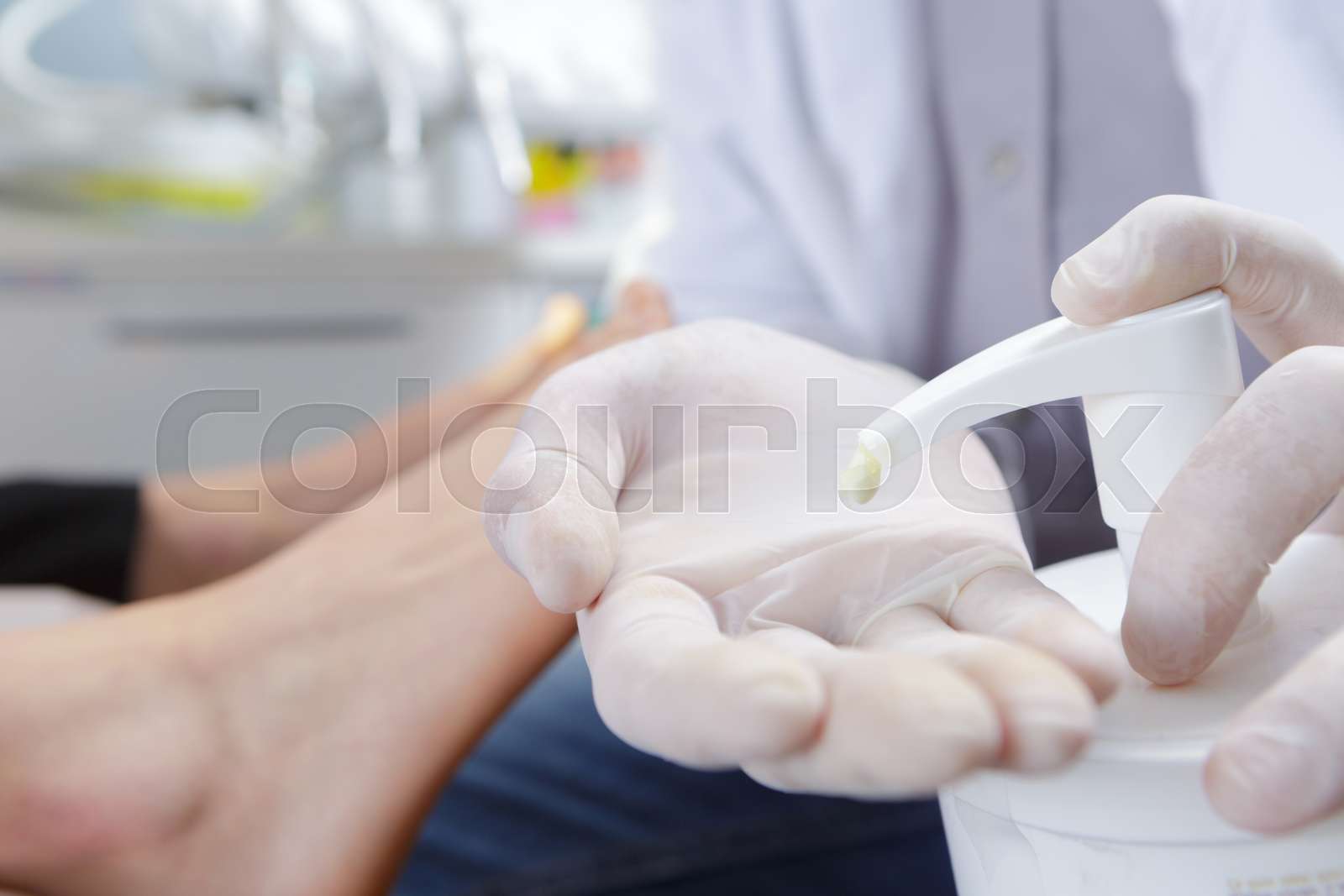 doctor ready to apply cream onto skin of a patient | Stock image ...