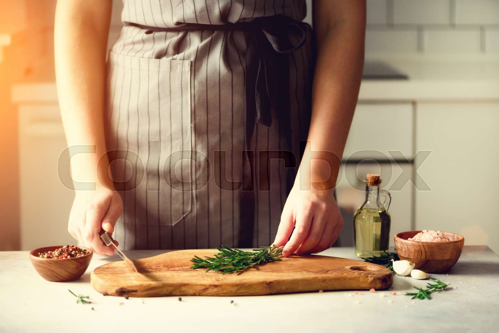 Woman Hands Cutting Fresh Green Rosemary On Wood Chopping Board In White Kitchen Interior Copy woman-hands-cutting-fresh-green-rosemary-on-wood-chopping-board-in-white-kitchen-interior-copy