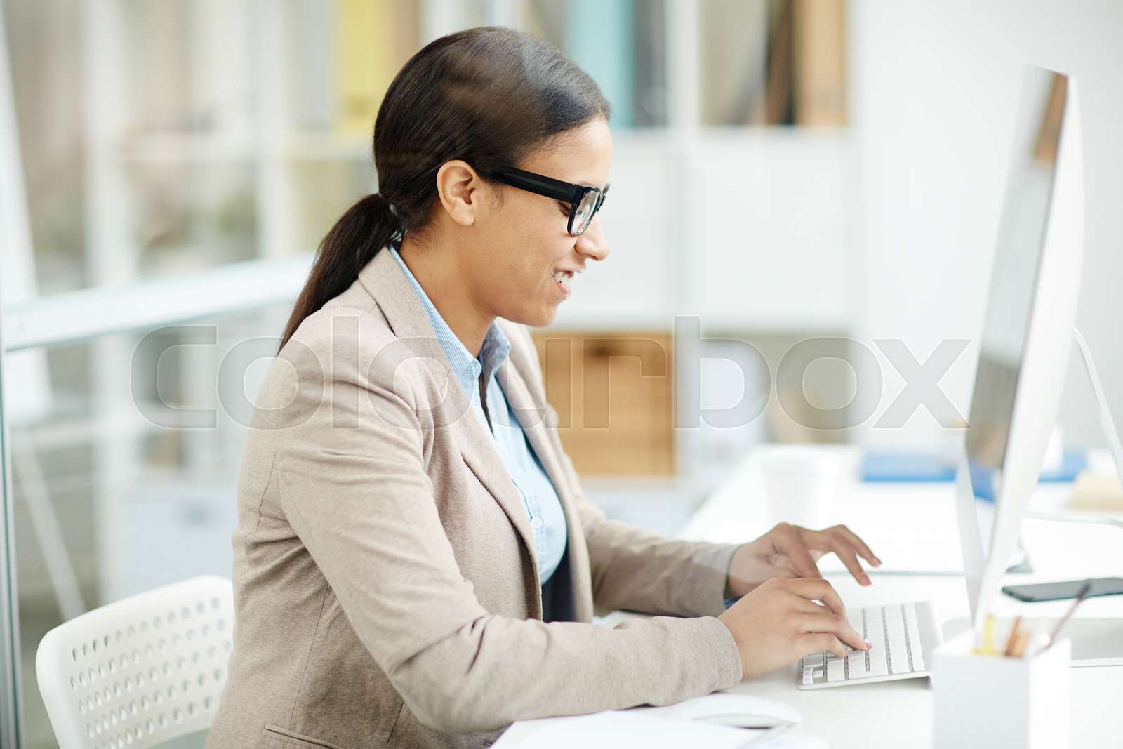 Secretary using computer | Stock image | Colourbox