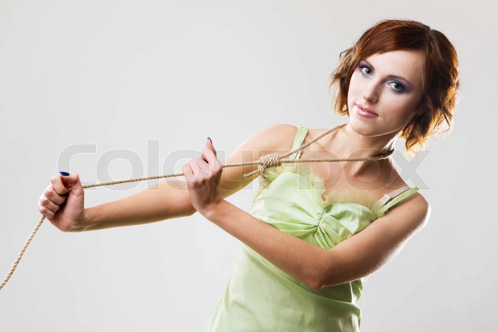 Beautiful woman with hangman's noose, studio photo | Stock image ...