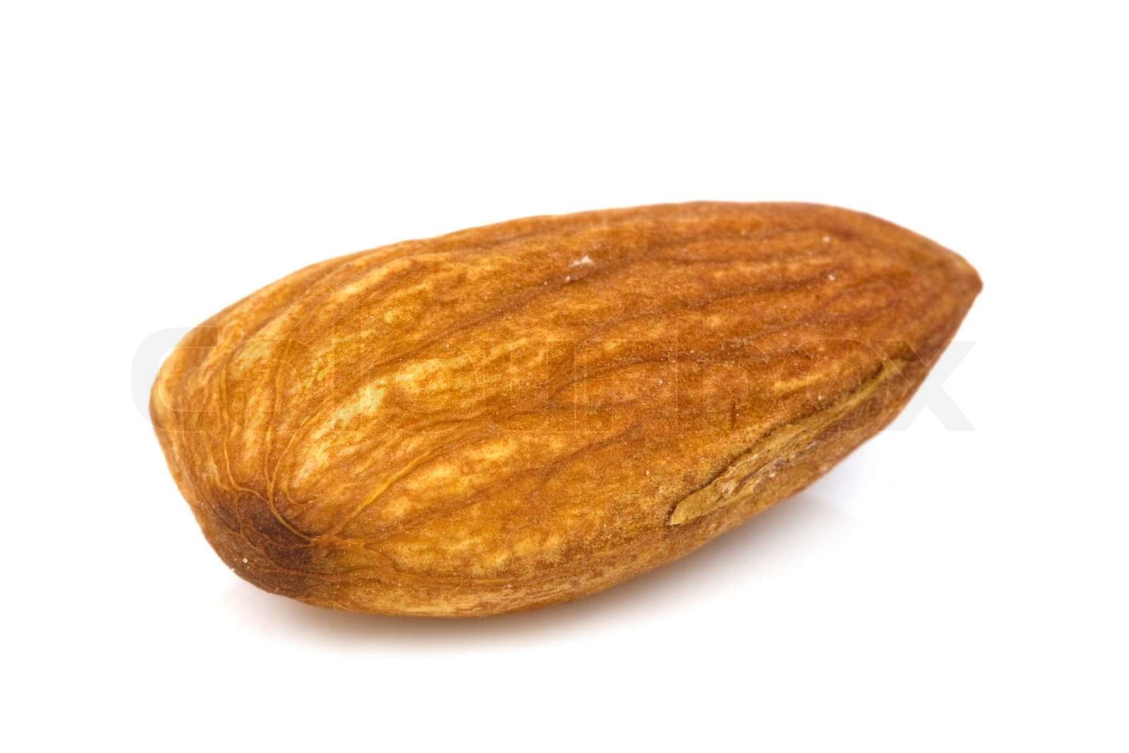 Macro almond isolated on a white | Stock image | Colourbox