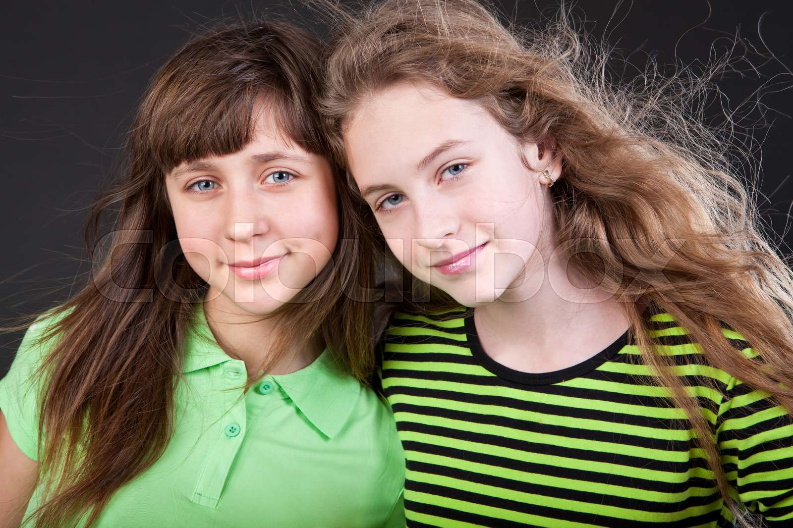 Two girl sisters best friends together smiling | Stock image | Colourbox