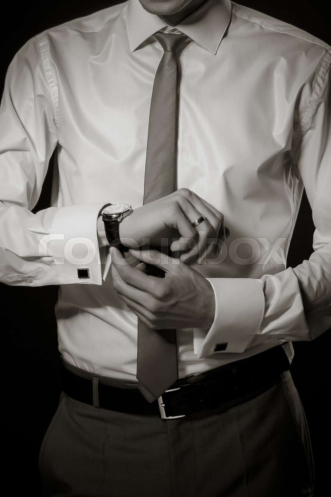 man is putting on a watch | Stock image | Colourbox