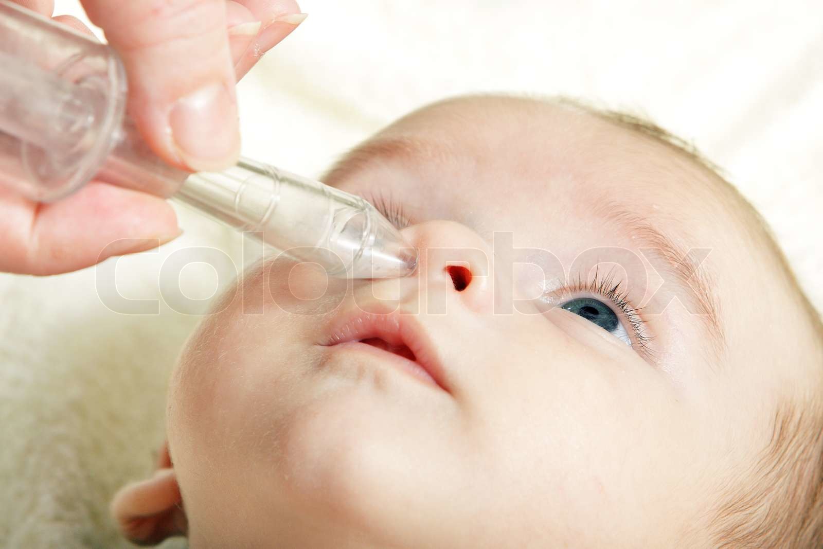 Newborn and suction runny nose | Stock image | Colourbox