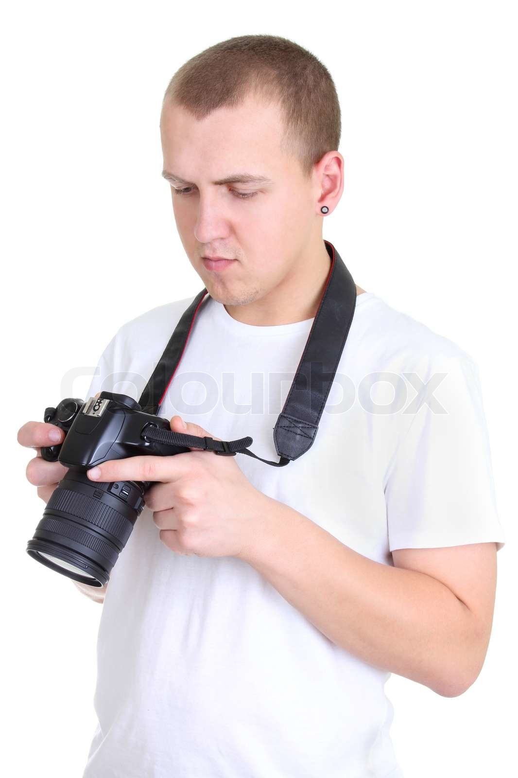 young man holding camera over white | Stock image | Colourbox