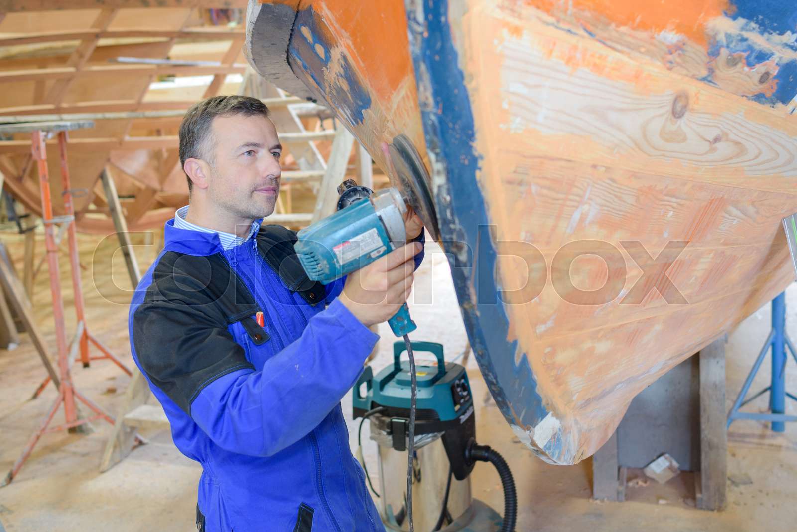 polishing the boat hull | Stock image | Colourbox