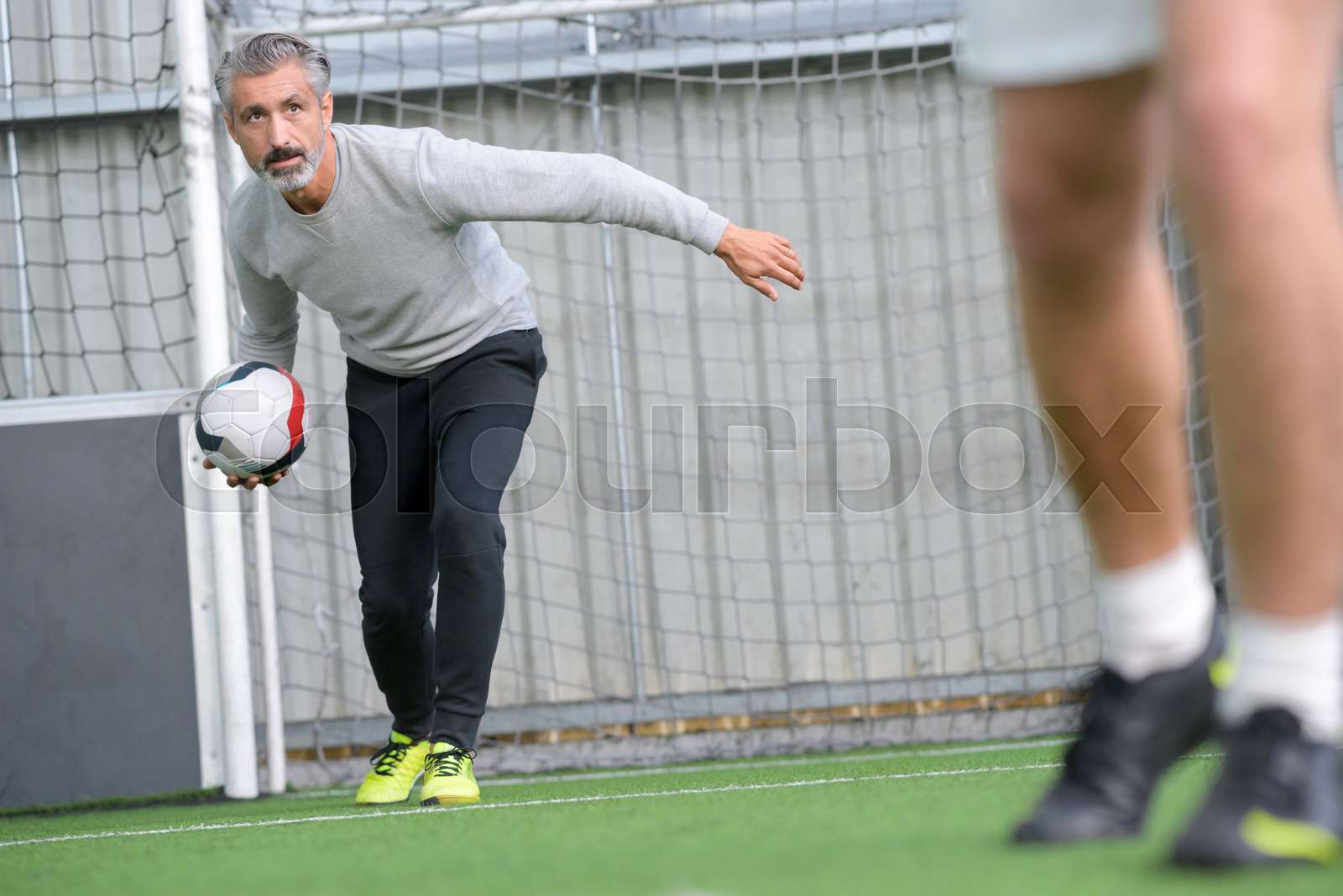 football coach with player | Stock image | Colourbox