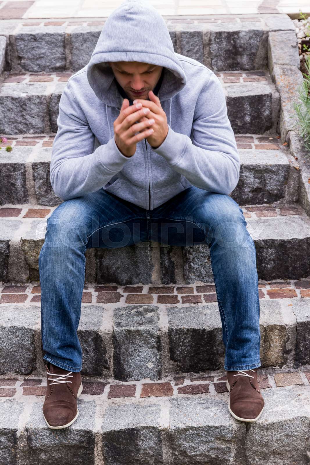 man is sitting on steps | Stock image | Colourbox