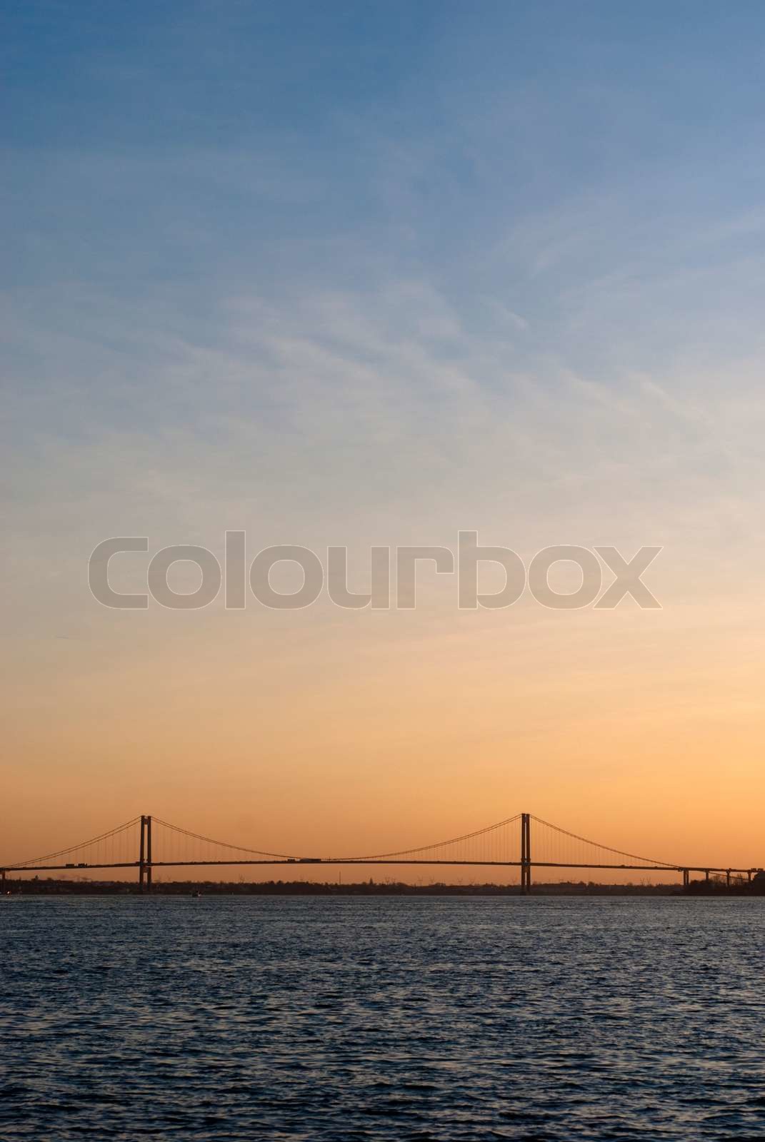 Suspension bridge and sunset | Stock image | Colourbox