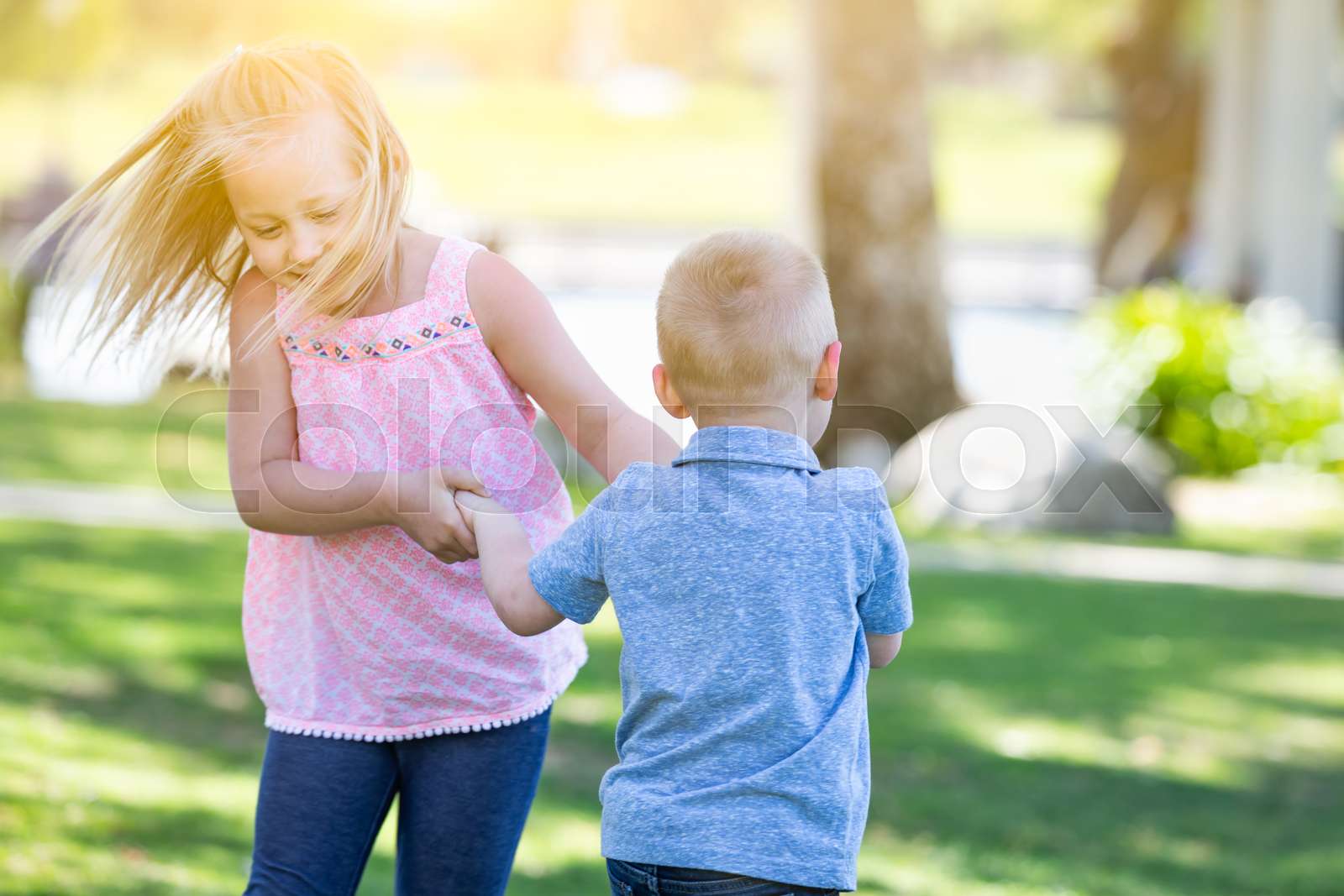 Young Brother and Sister Playing At The Park Togther | Stock image ...