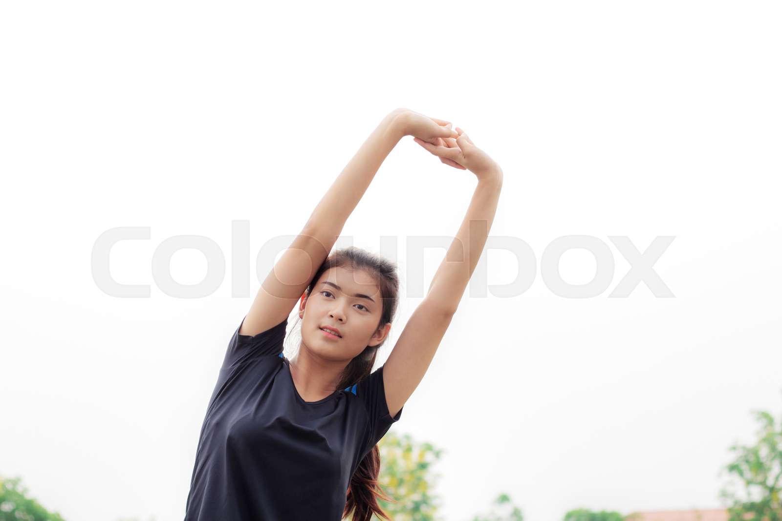 Girl is warming body. | Stock image | Colourbox