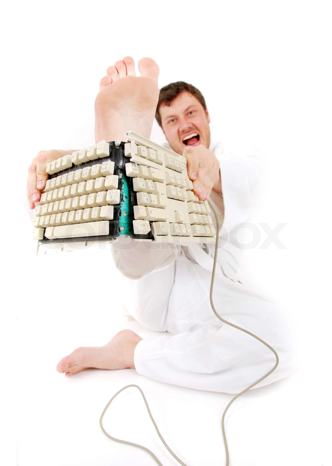 angry fighter is destroying keyboard | Stock image | Colourbox