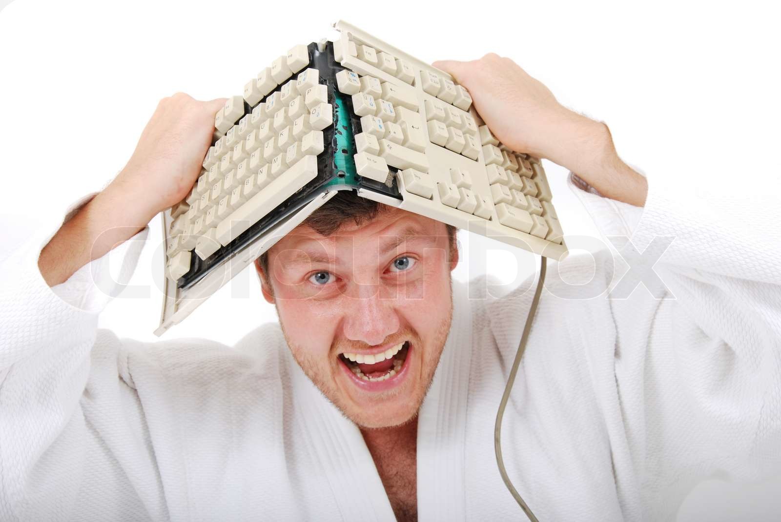 angry fighter is destroying keyboard | Stock image | Colourbox
