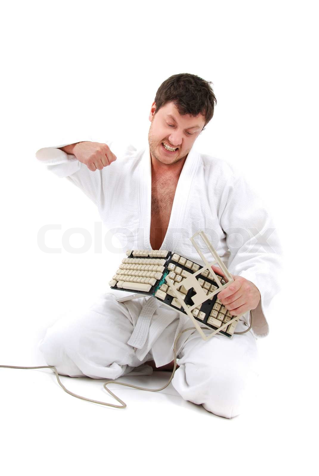 angry fighter is destroying keyboard | Stock image | Colourbox