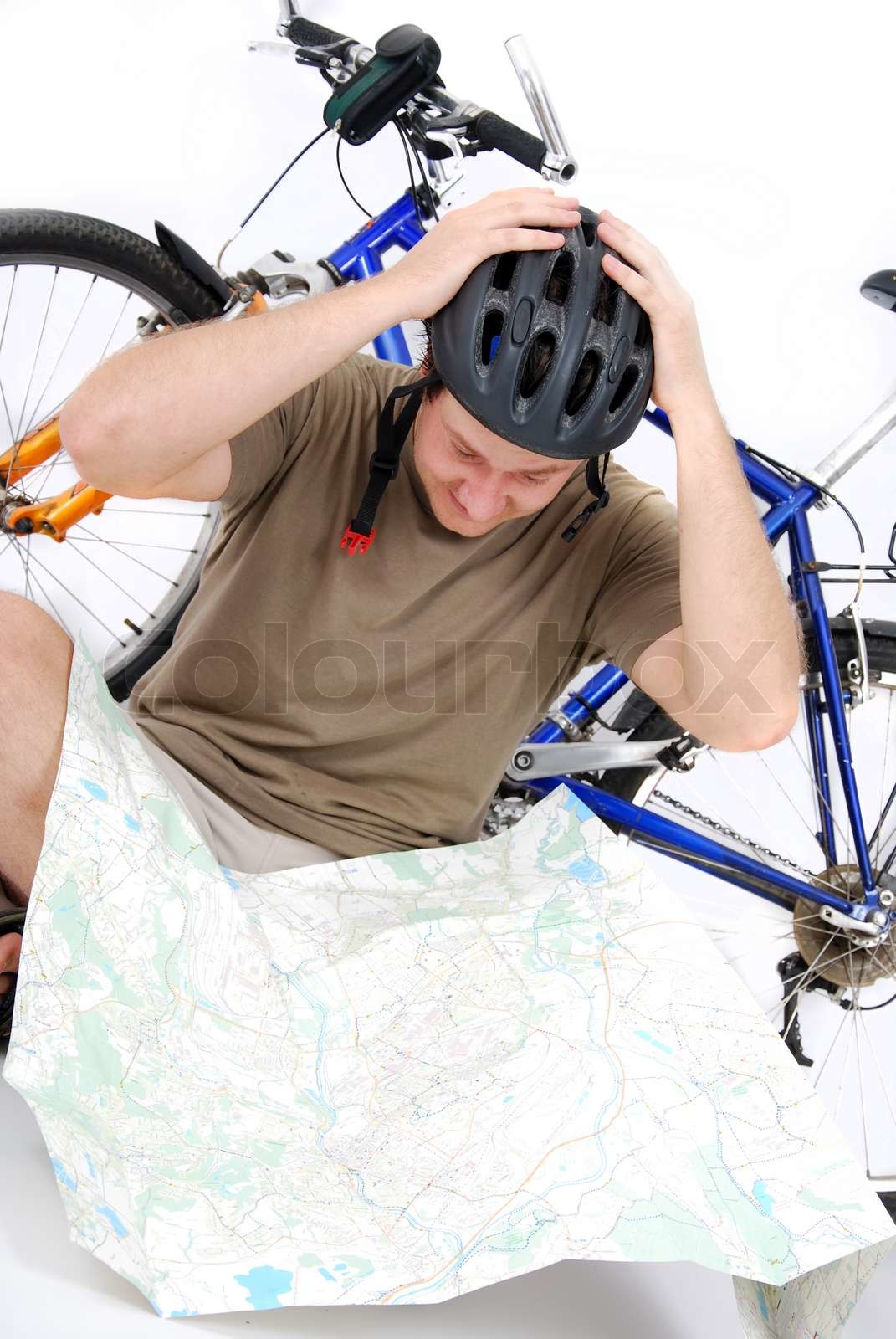 lost biker man with map | Stock image | Colourbox