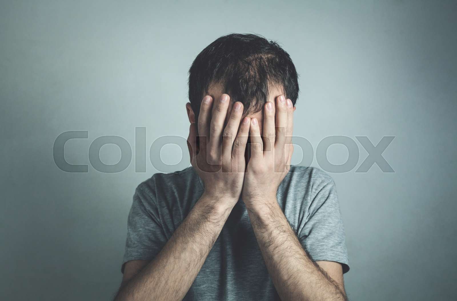 Caucasian depressed man with hands covering his face. | Stock image ...