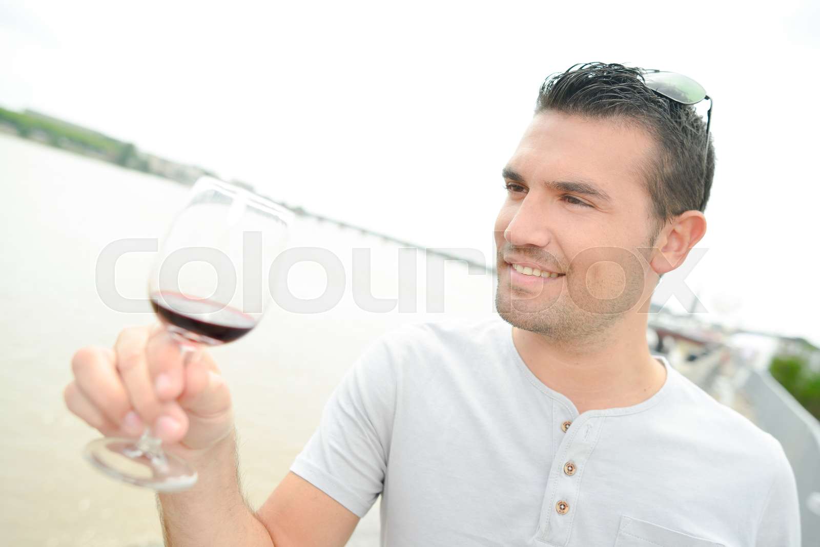 Man holding a glass of wine | Stock image | Colourbox
