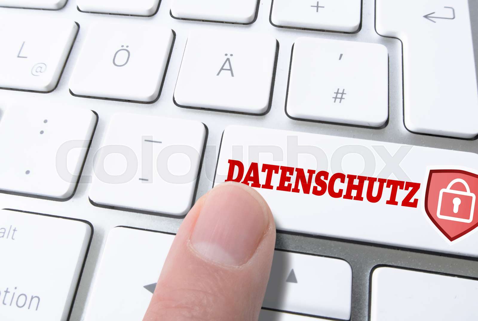 pressing key labeled DATENSCHUTZ, German for data privacy, on computer keyboardputer keyboard ...