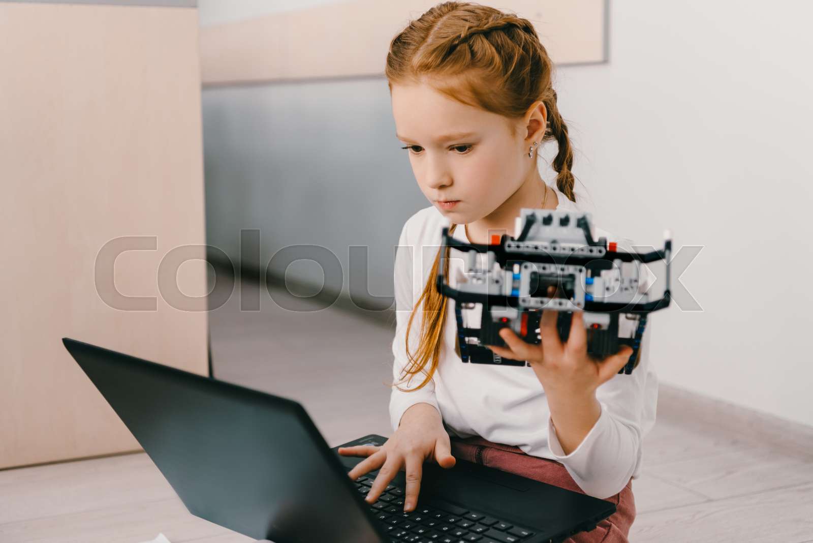 beautiful concentrated child programming diy robot, stem education ...