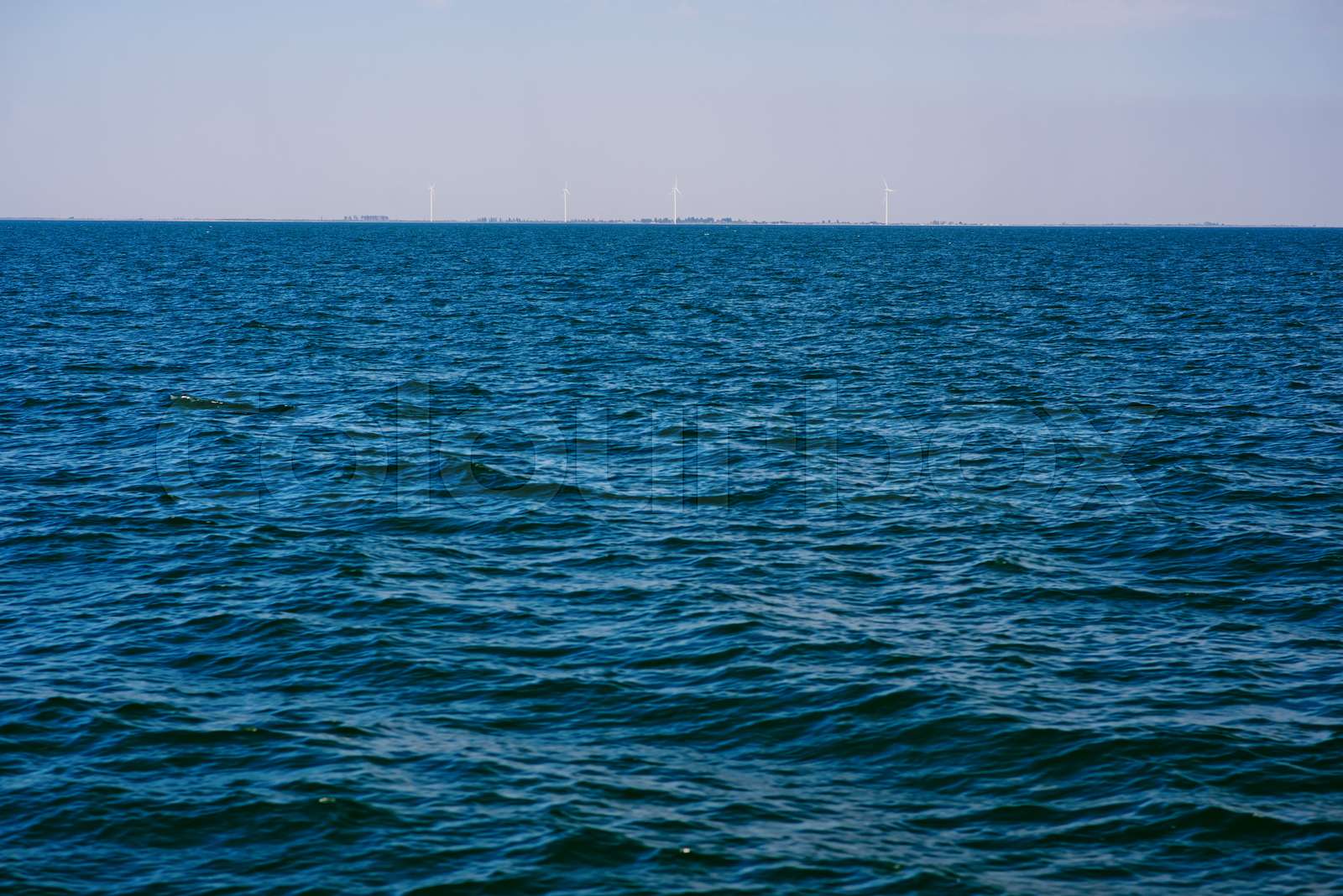 the blue ocean with dull clouds on a lovely sunny day | Stock image ...