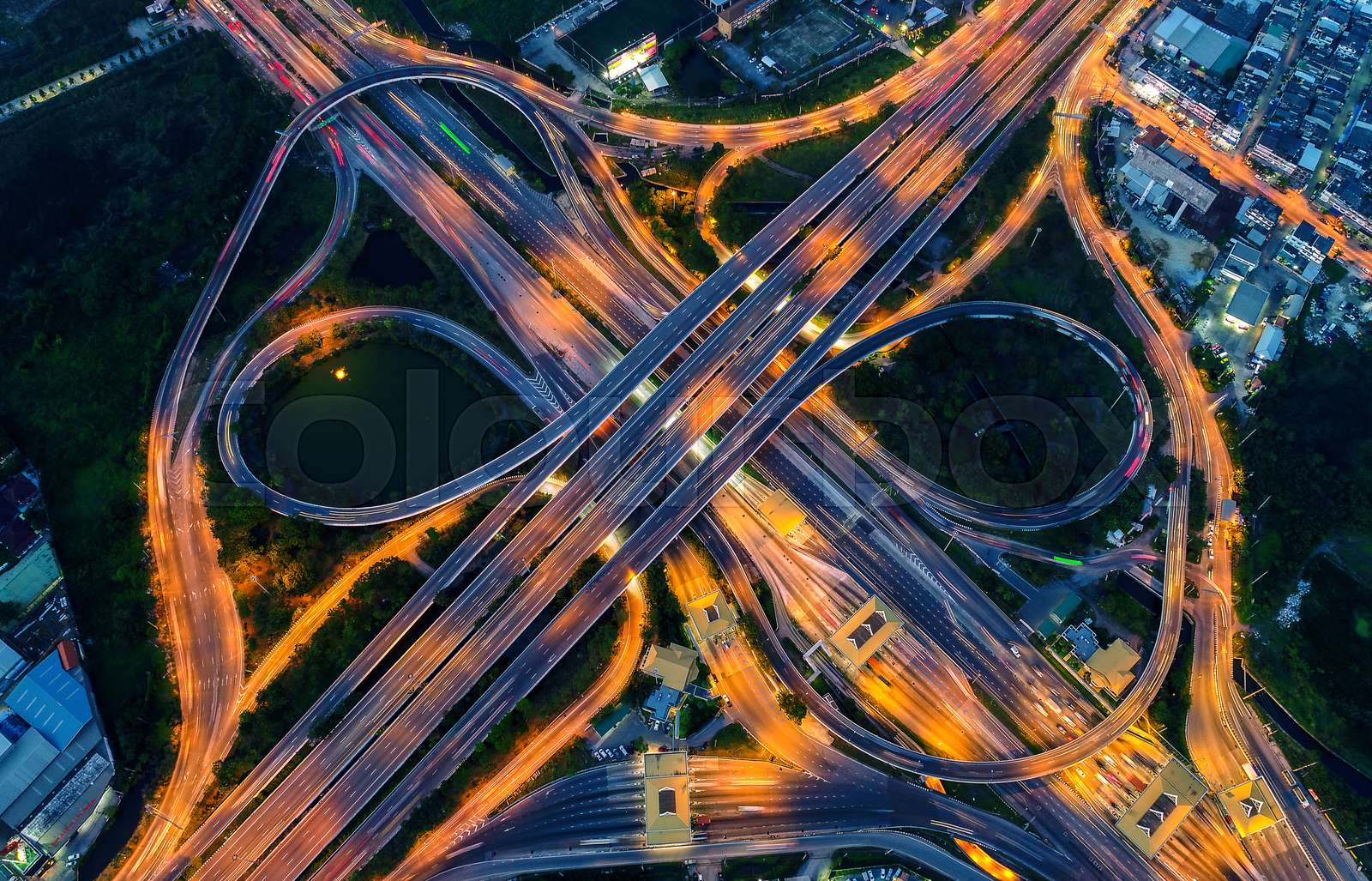 Aerial view of cityscape and traffic on highway at night. | Stock image ...