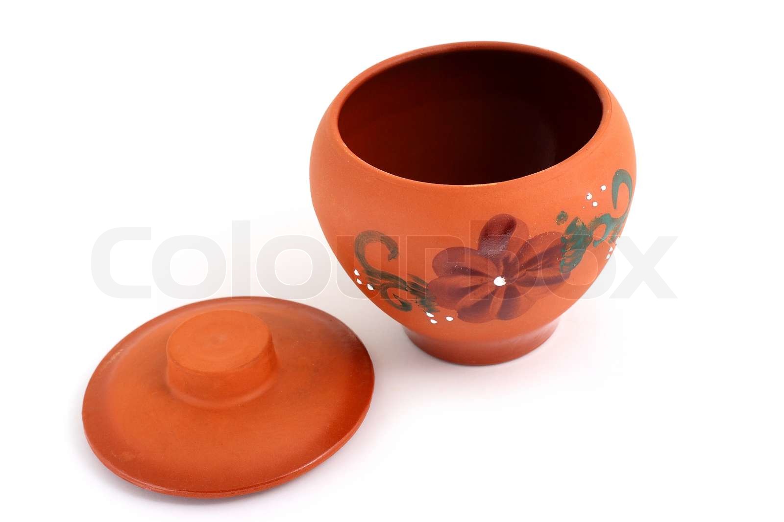 Orange clay pot with a pattern for meal preparation | Stock image ...