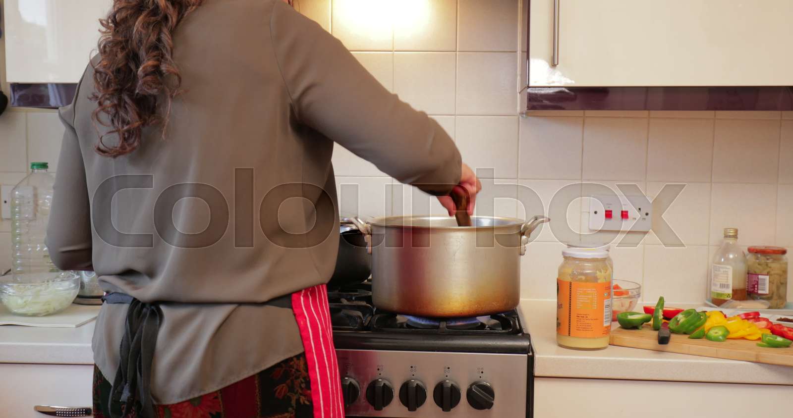 Woman Making Curry at Home | Stock video | Colourbox