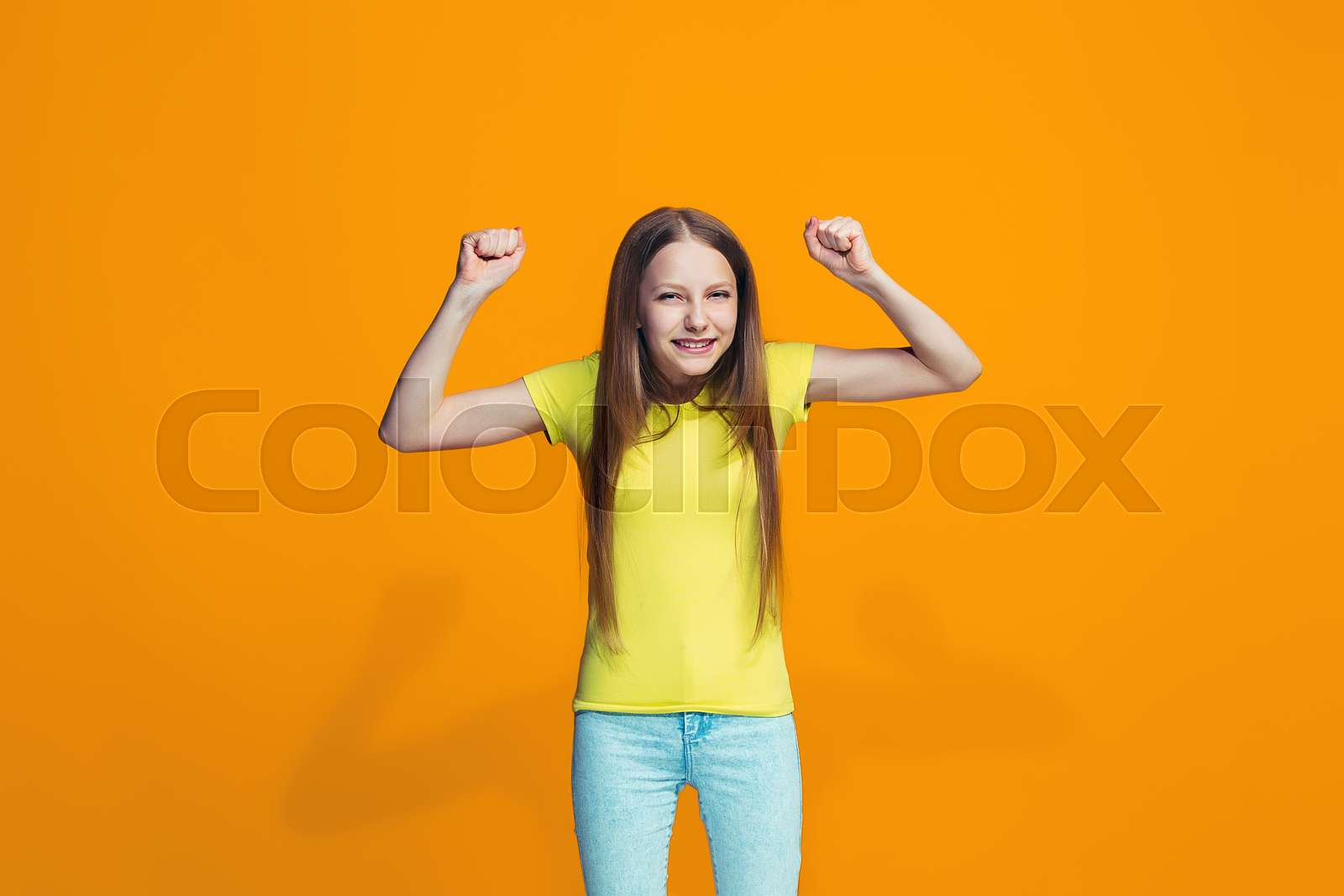 Happy success teen girl celebrating being a winner. Dynamic energetic ...