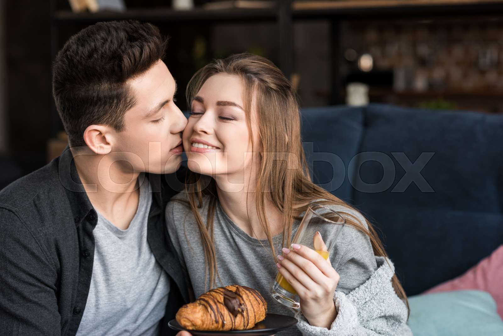 boyfriend kissing girlfriend during breakfast | Stock image | Colourbox