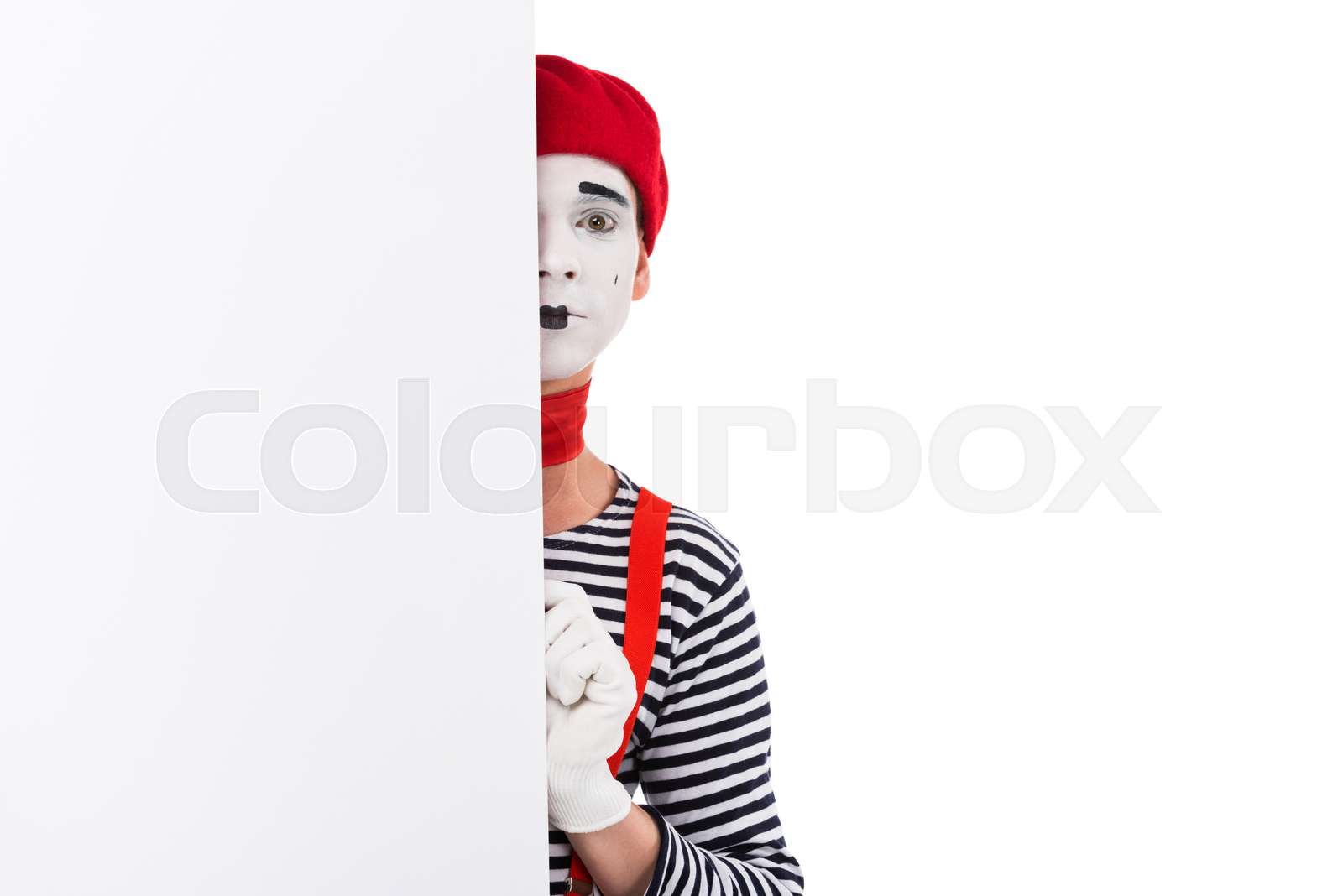 mime looking out from empty board isolated on white | Stock image ...