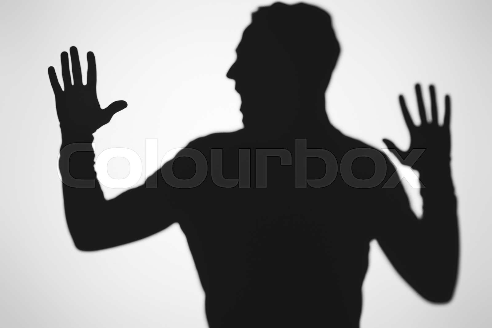 scary blurry shadow of person screaming on grey | Stock image | Colourbox