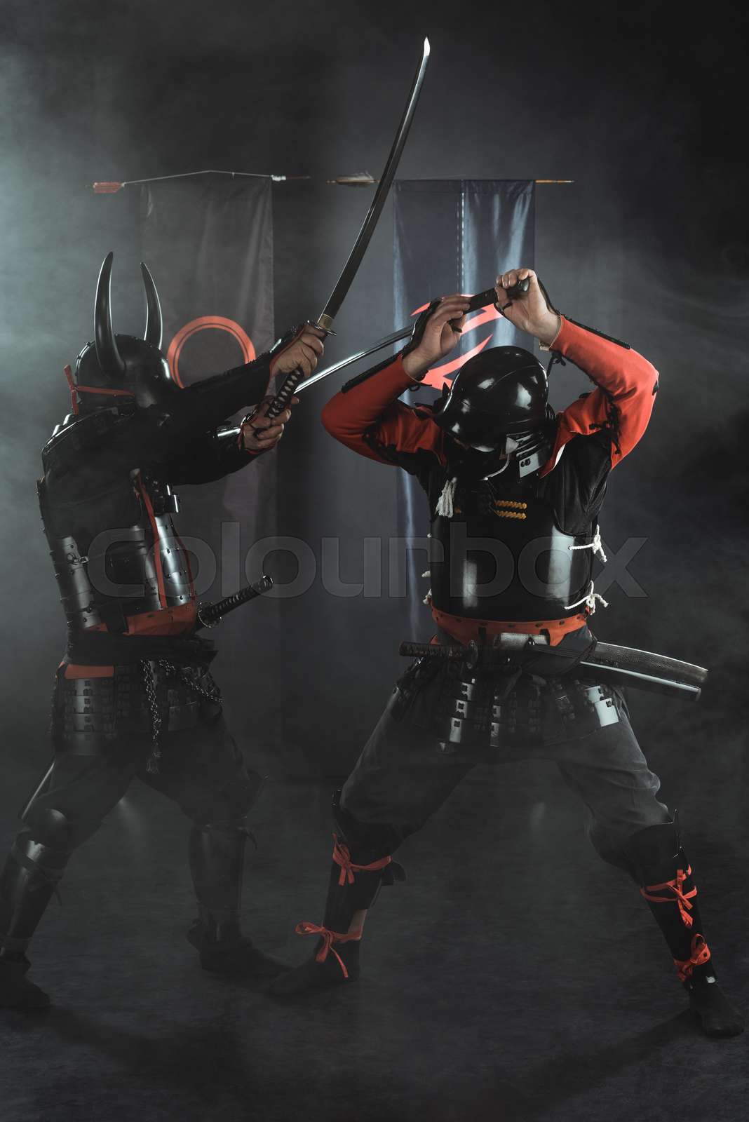 traditional armored samurai fighting with swords on black | Stock image ...