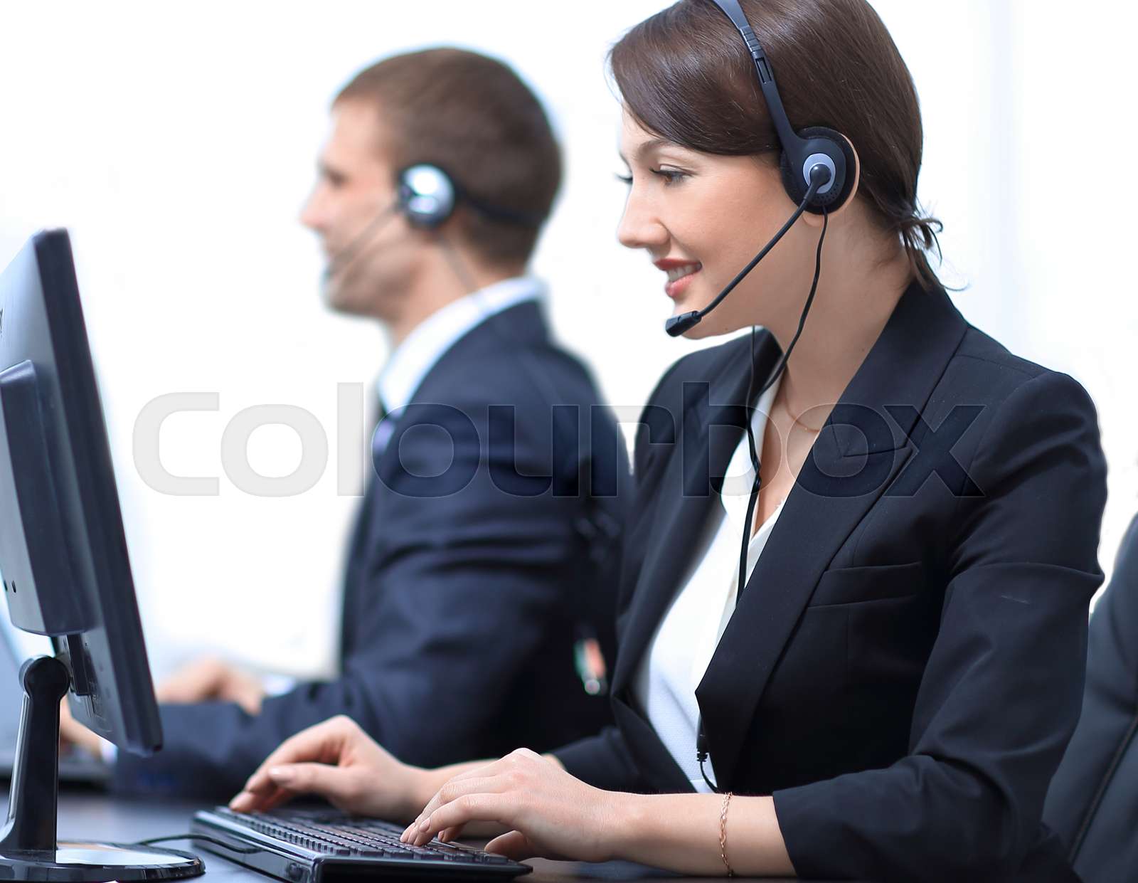 Female Customer Services Agent With Headset Working In A Call Center ...