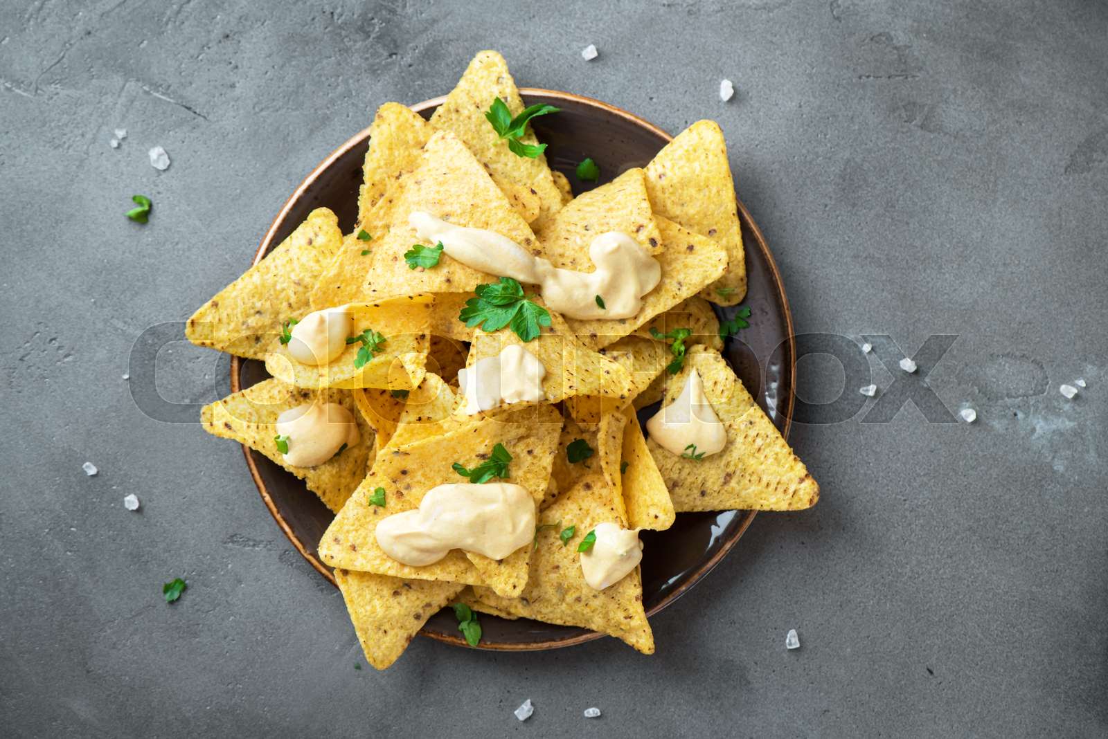 Nachos chips and cheese sauce | Stock image | Colourbox