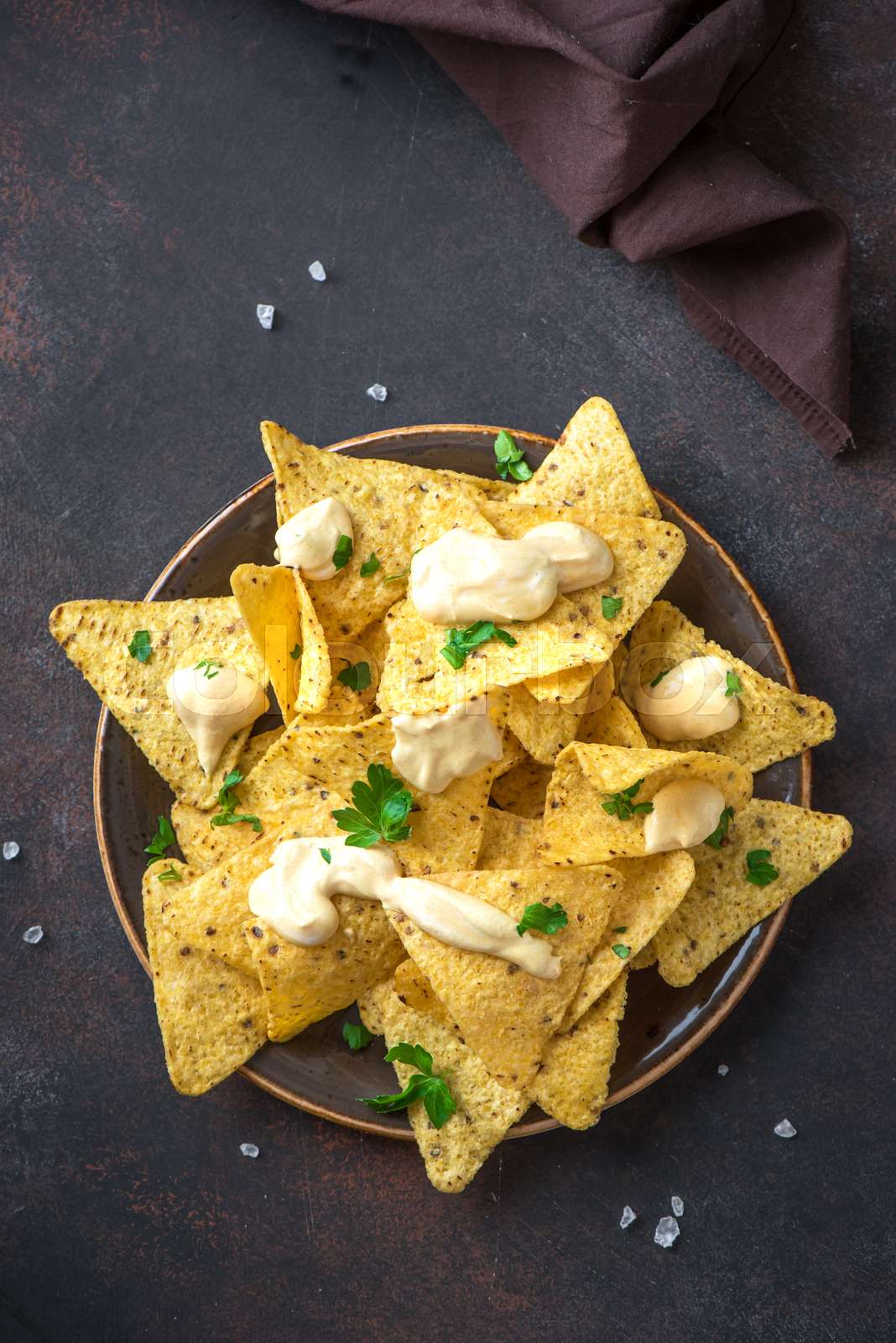 Nachos chips and cheese sauce | Stock image | Colourbox